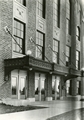 Women practicing tumbling behind Romney Gym