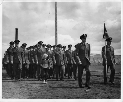 Boy marching with ROTC soldiers