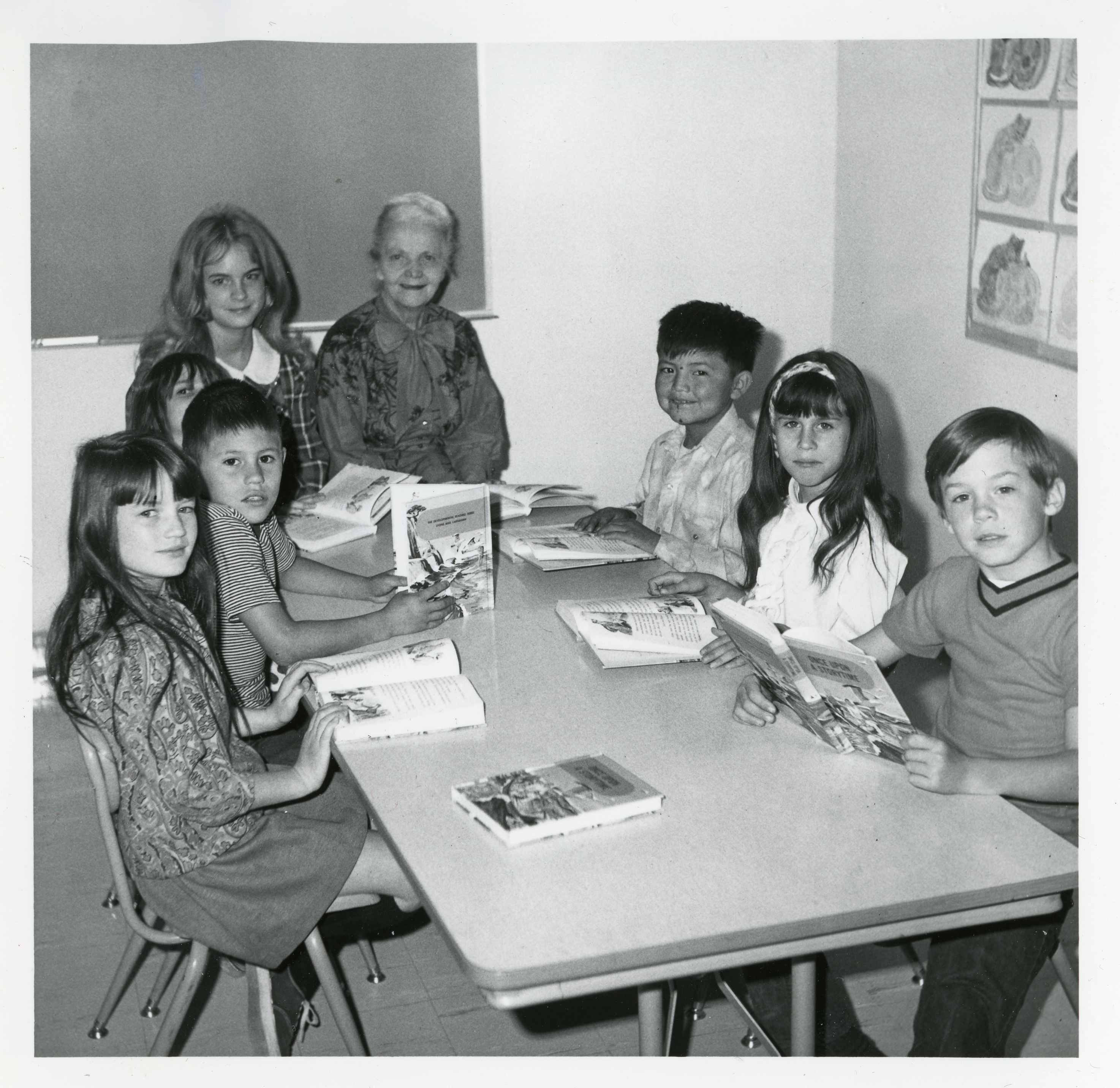 Student working with elementary school children