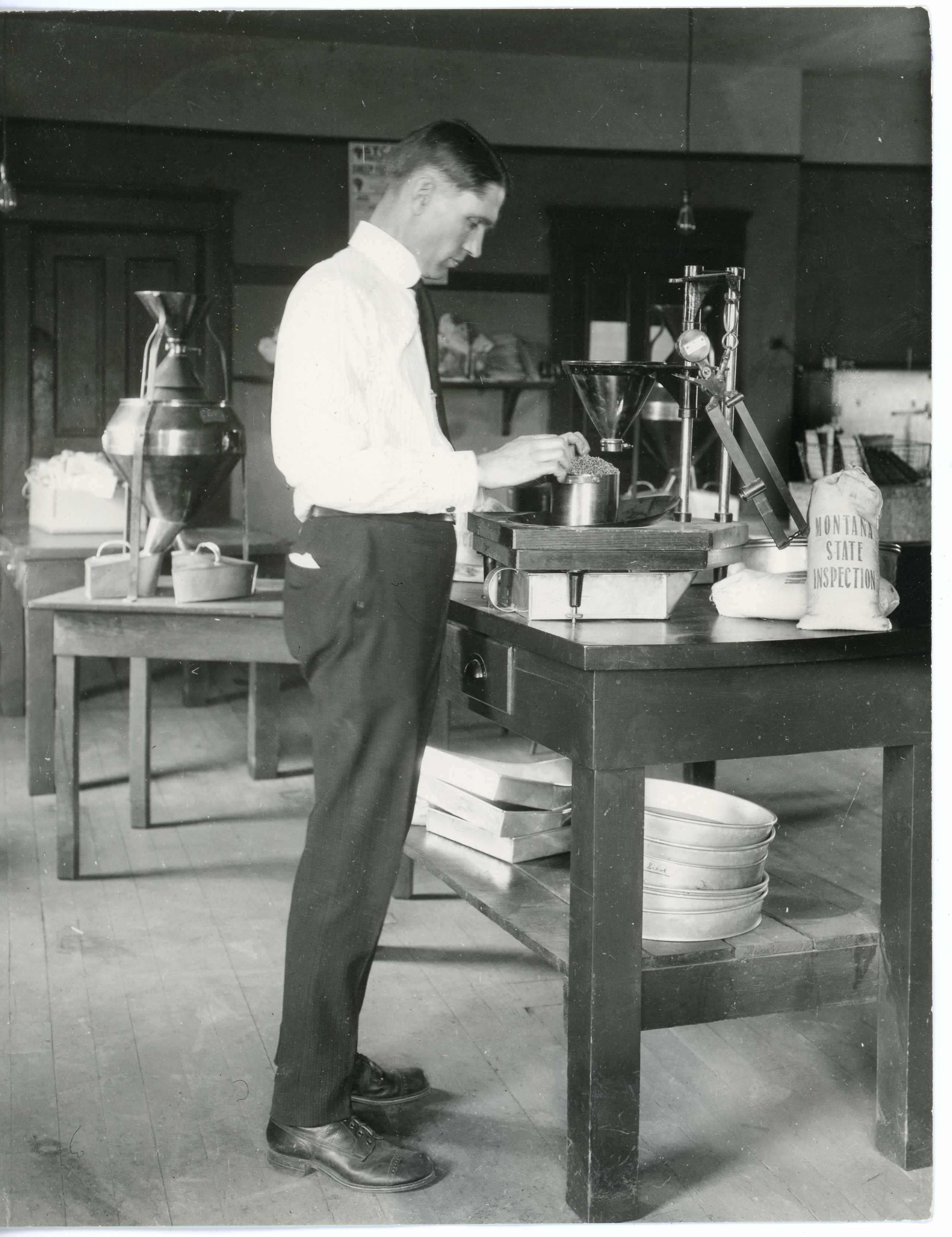 Man determining the test weight grain per bushel
