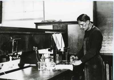 Man standing in a chemistry laboratory, 1920s