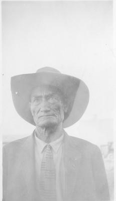 Phot of Eli Guardipee wearing a cowboy hat.